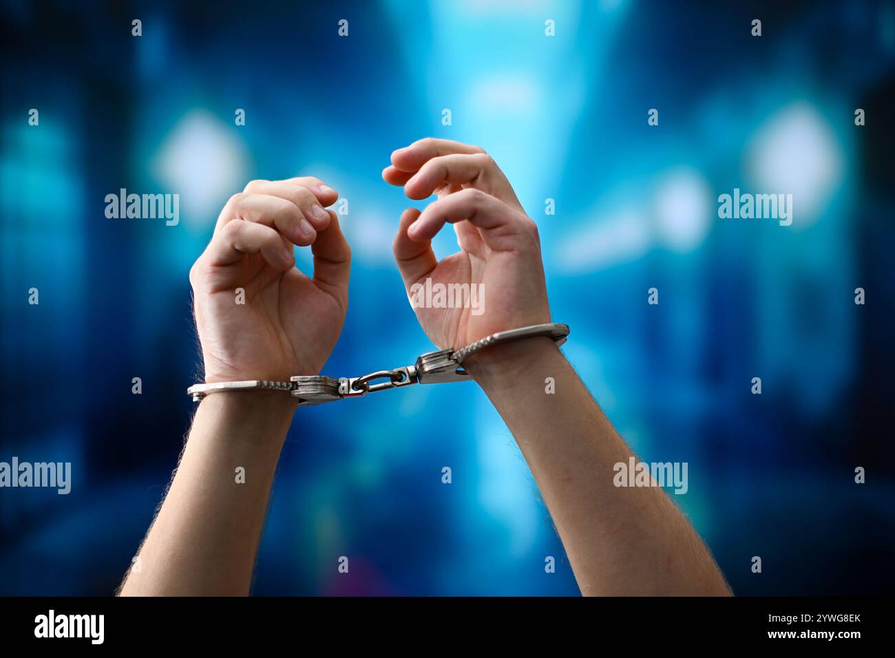 Handcuffed wrists of a criminal arrested for committing a crime, law ...