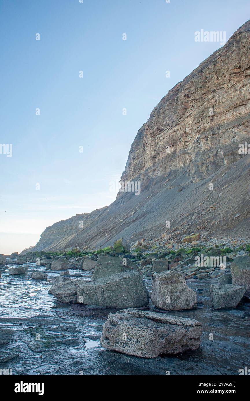 rocks and boulders on the wave cut platform at the base of hunt cliff ...