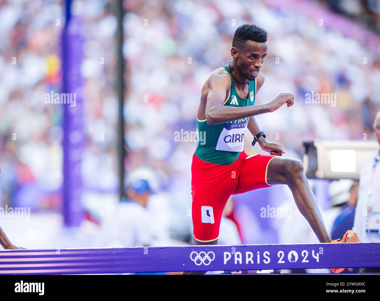 Lamecha Girma participating in the 3000 metres steeplechase at the ...