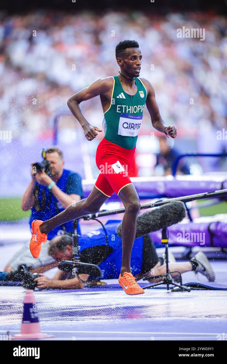 Lamecha Girma participating in the 3000 metres steeplechase at the ...