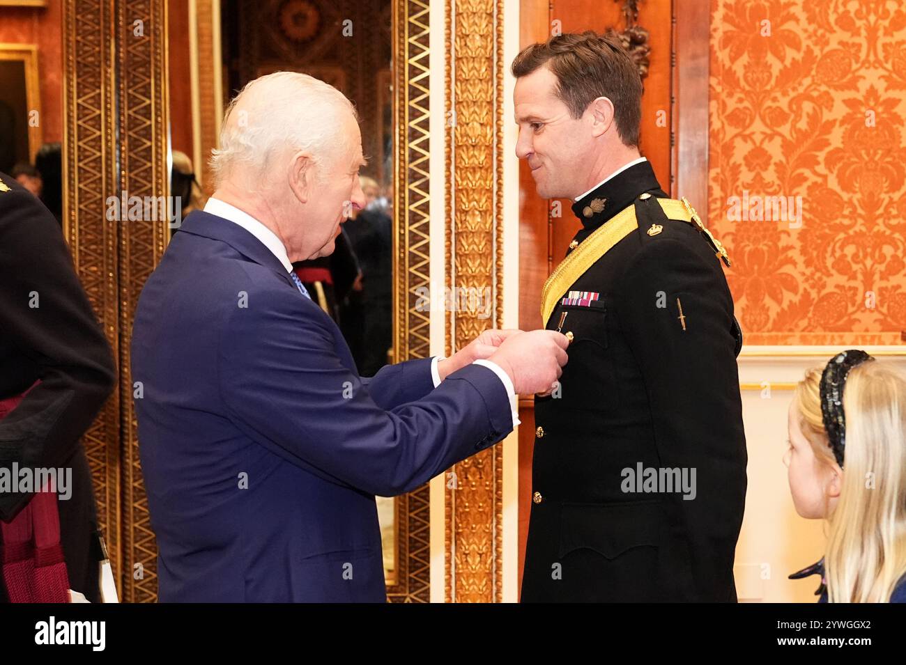 Major Harry Wallace, Royal Artillery, is decorated with the King's ...