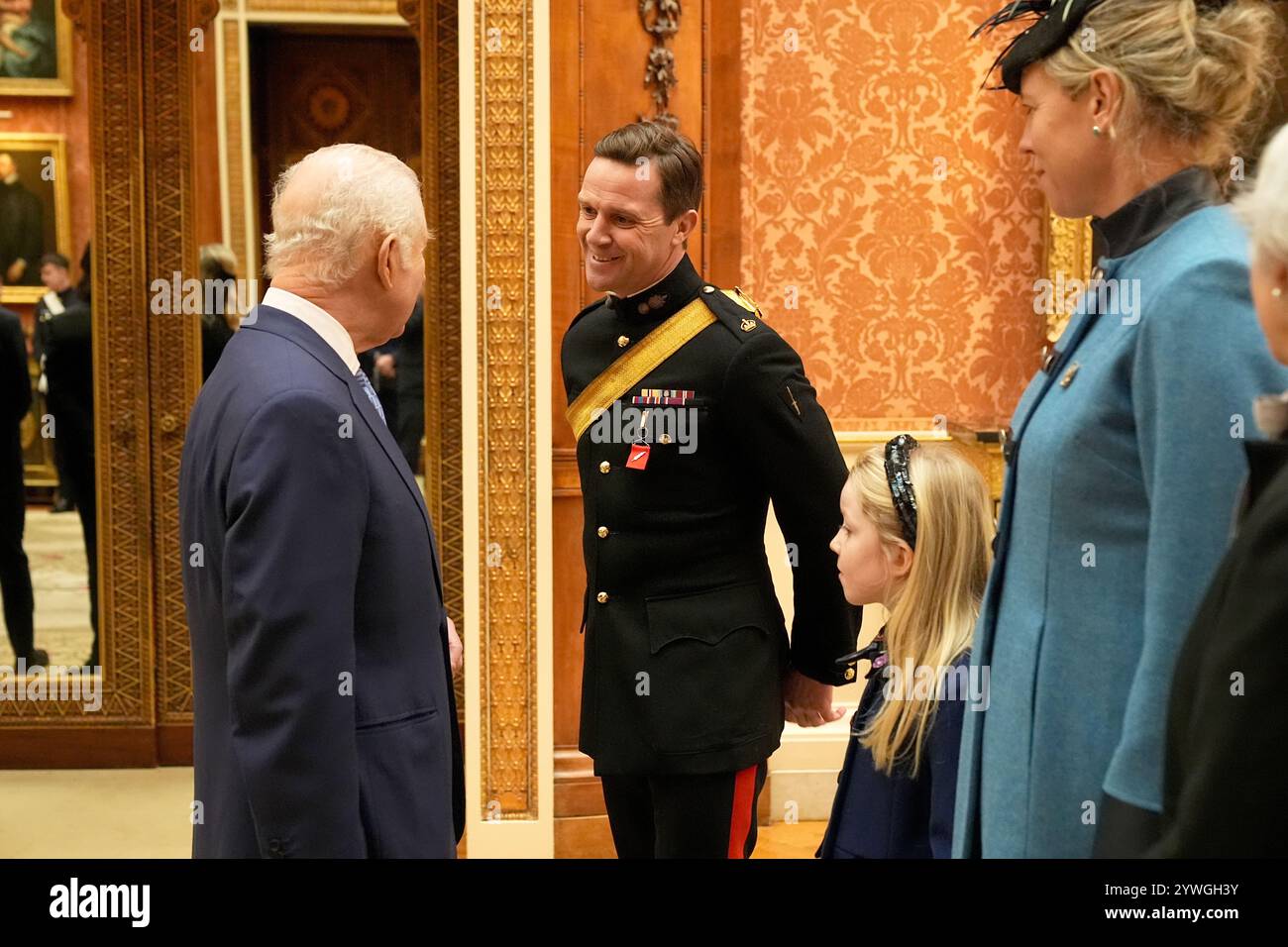 Major Harry Wallace, Royal Artillery, is decorated with the King's ...