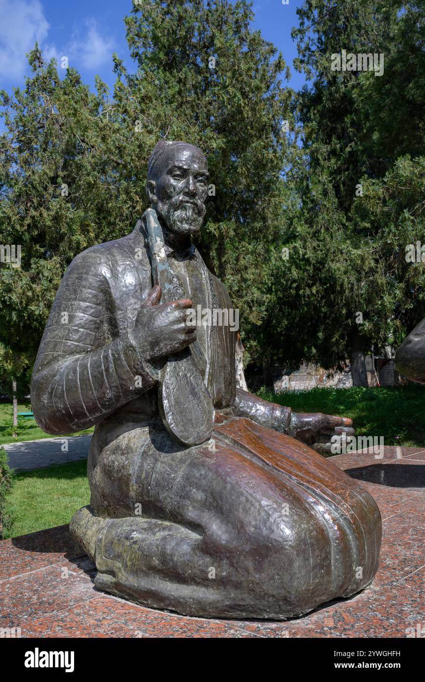SAMARKAND, UZBEKISTAN - MAY 18, 2024. Sculpture of a musician with a ...