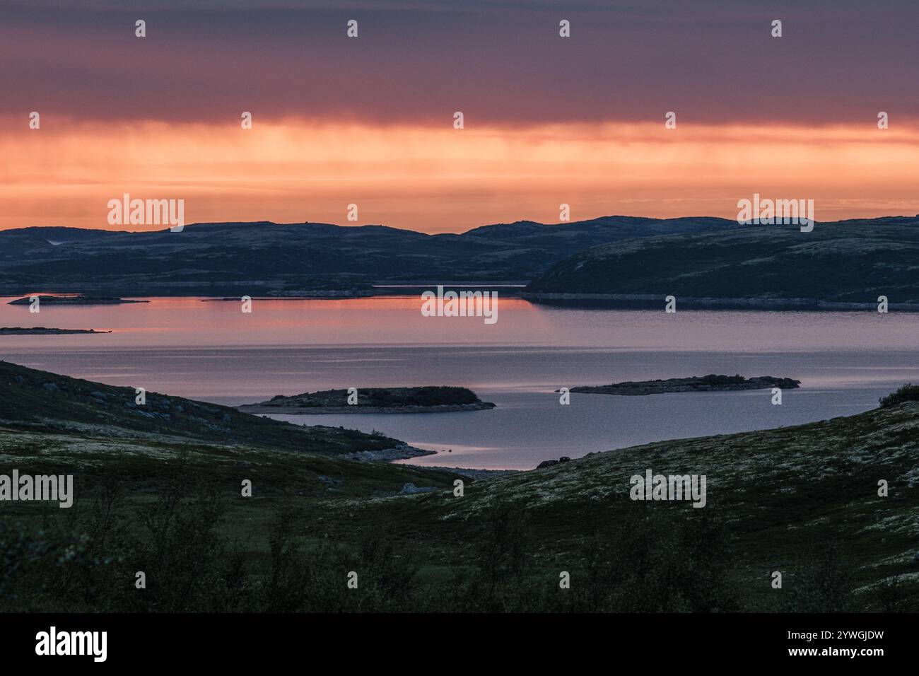 Orange sky over a scottish loch at sunrise hi-res stock photography and ...