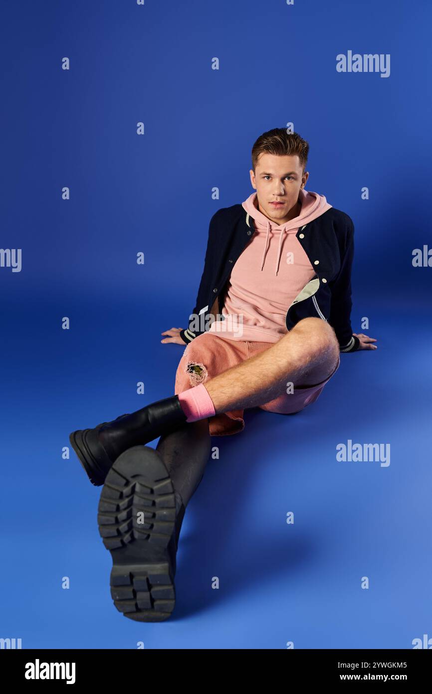Man with prosthetic leg sits confidently, wearing stylish attire ...