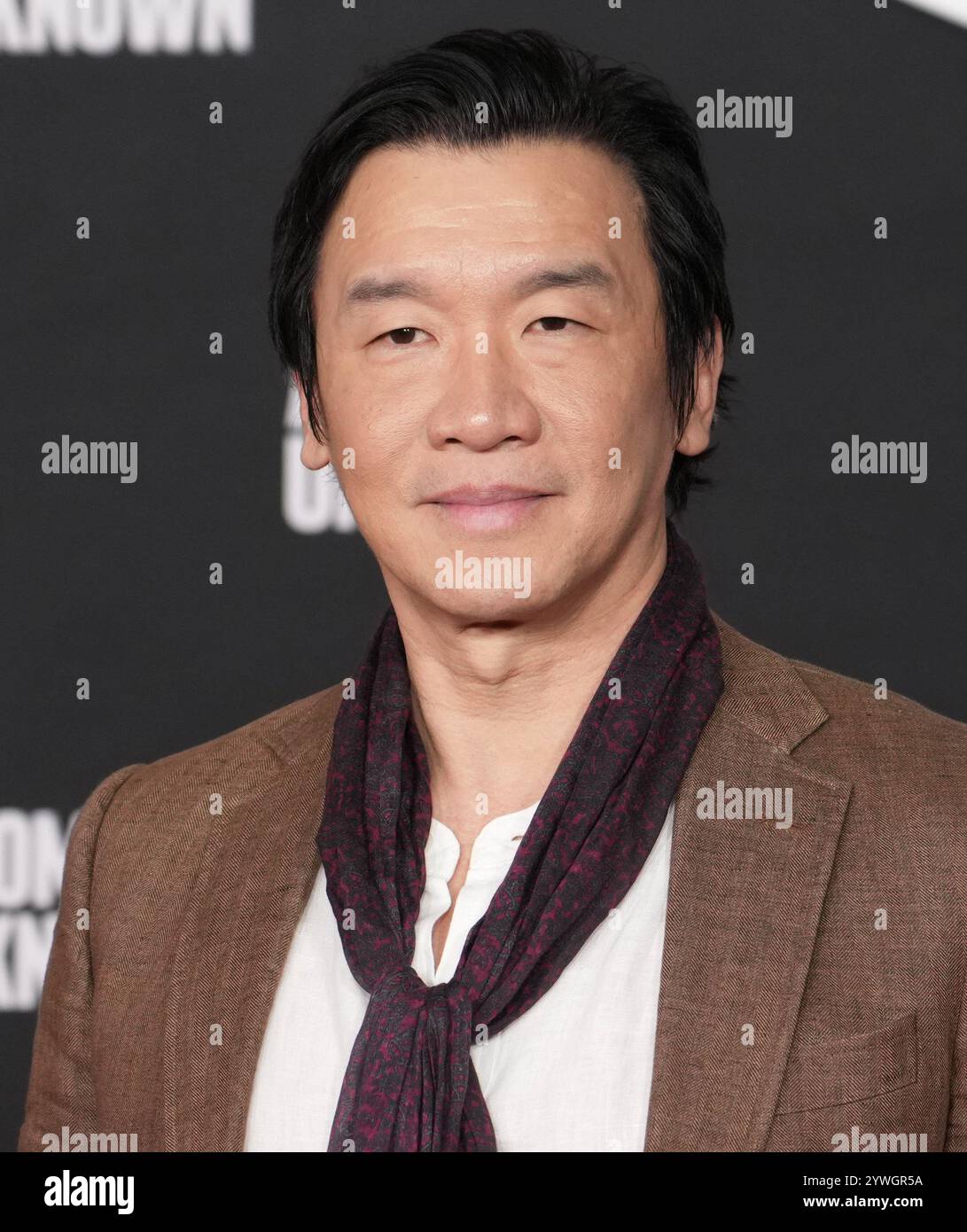 Chin Han arrives at A COMPLETE UNKNOWN World Premiere held at the Dolby ...