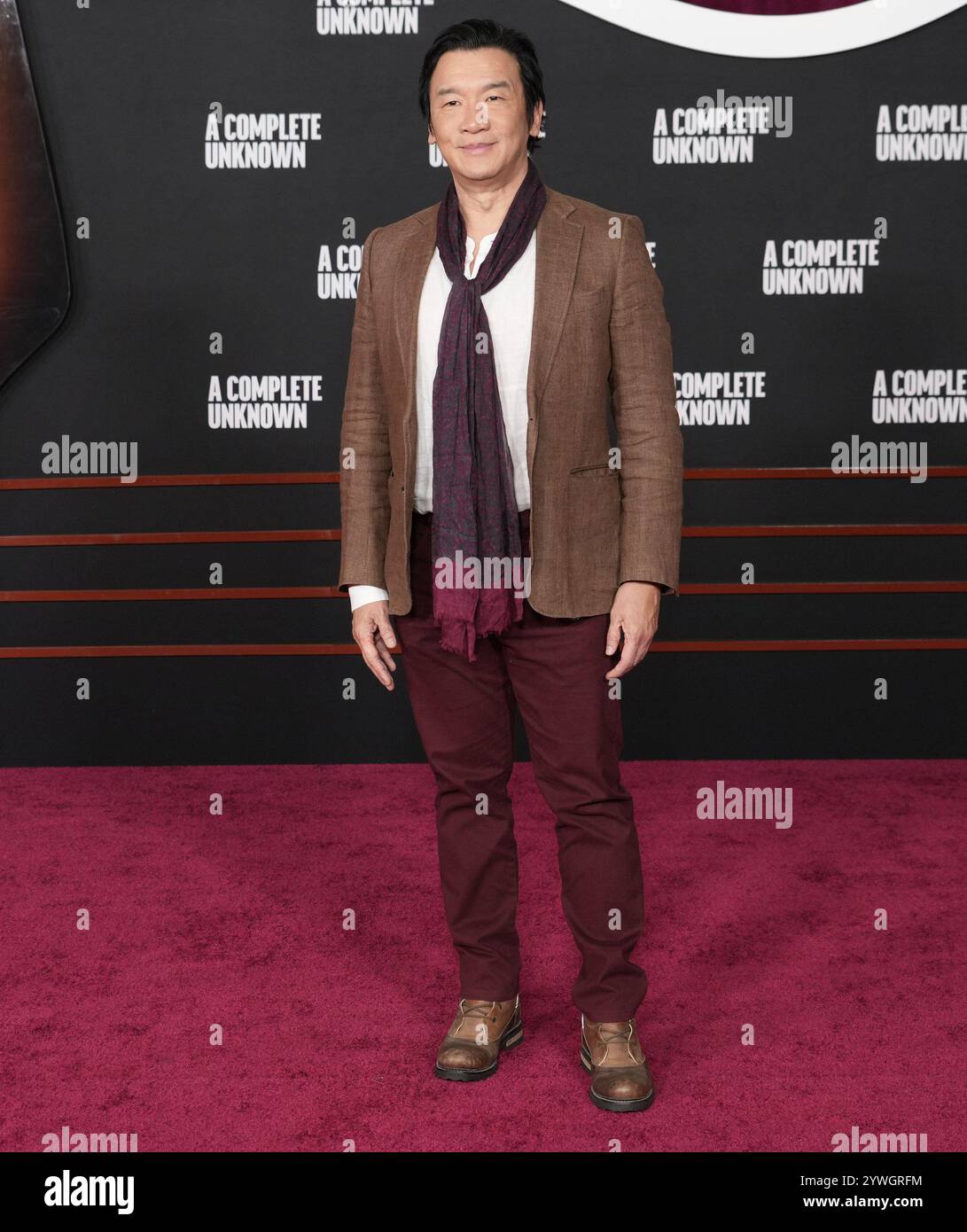 Chin Han arrives at A COMPLETE UNKNOWN World Premiere held at the Dolby ...