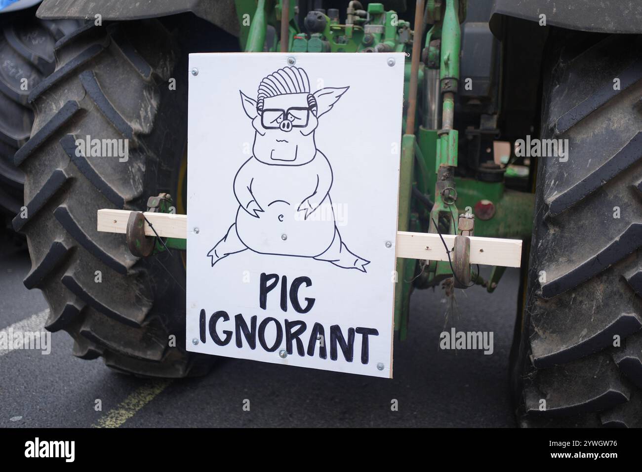 A banner on a tractor parked on Whitehall during a protest by farmers ...