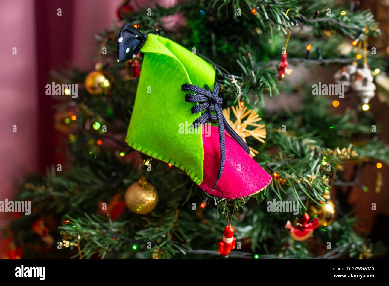 Hand made elf boot in a Christmas tree, soft focus close up Stock Photo ...