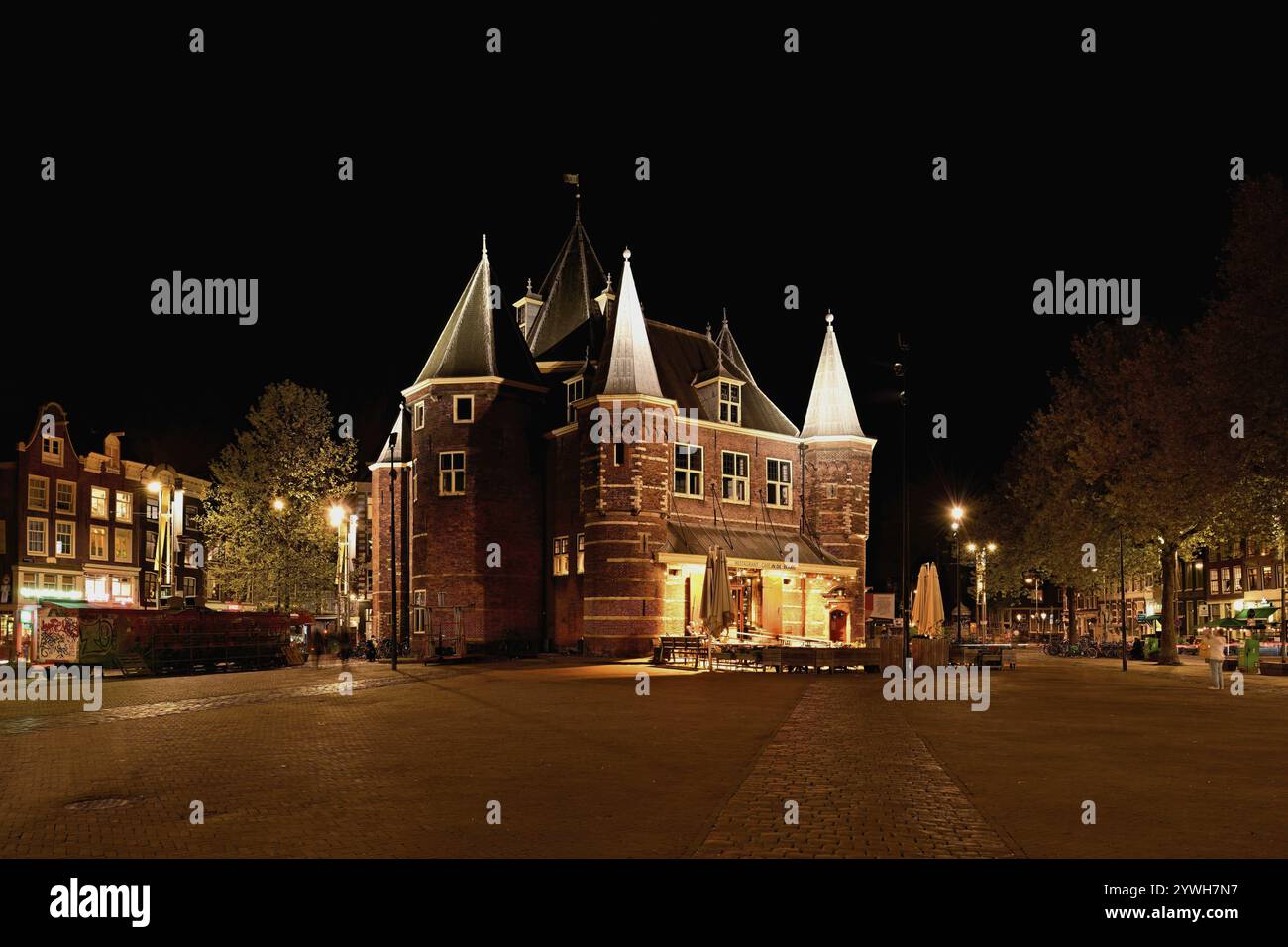 Medieval building De Waag illuminated at night, at Nieuwmarkt ...