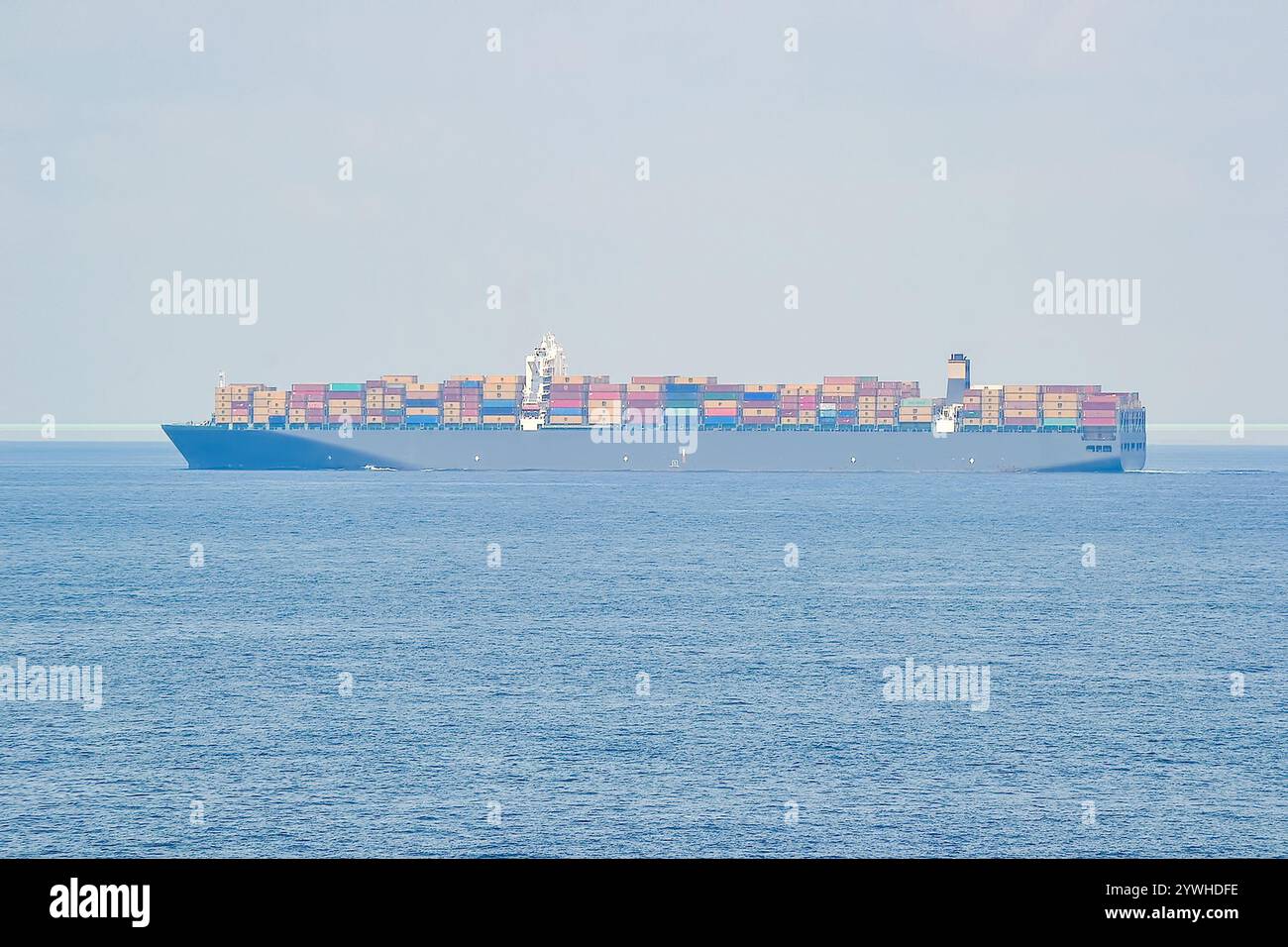 Large cargo vessel navigates serene hi-res stock photography and images ...