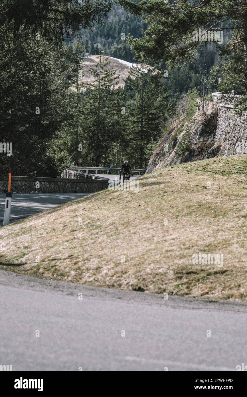 Road bike rider in spring in the Allgaeu against the picturesque ...
