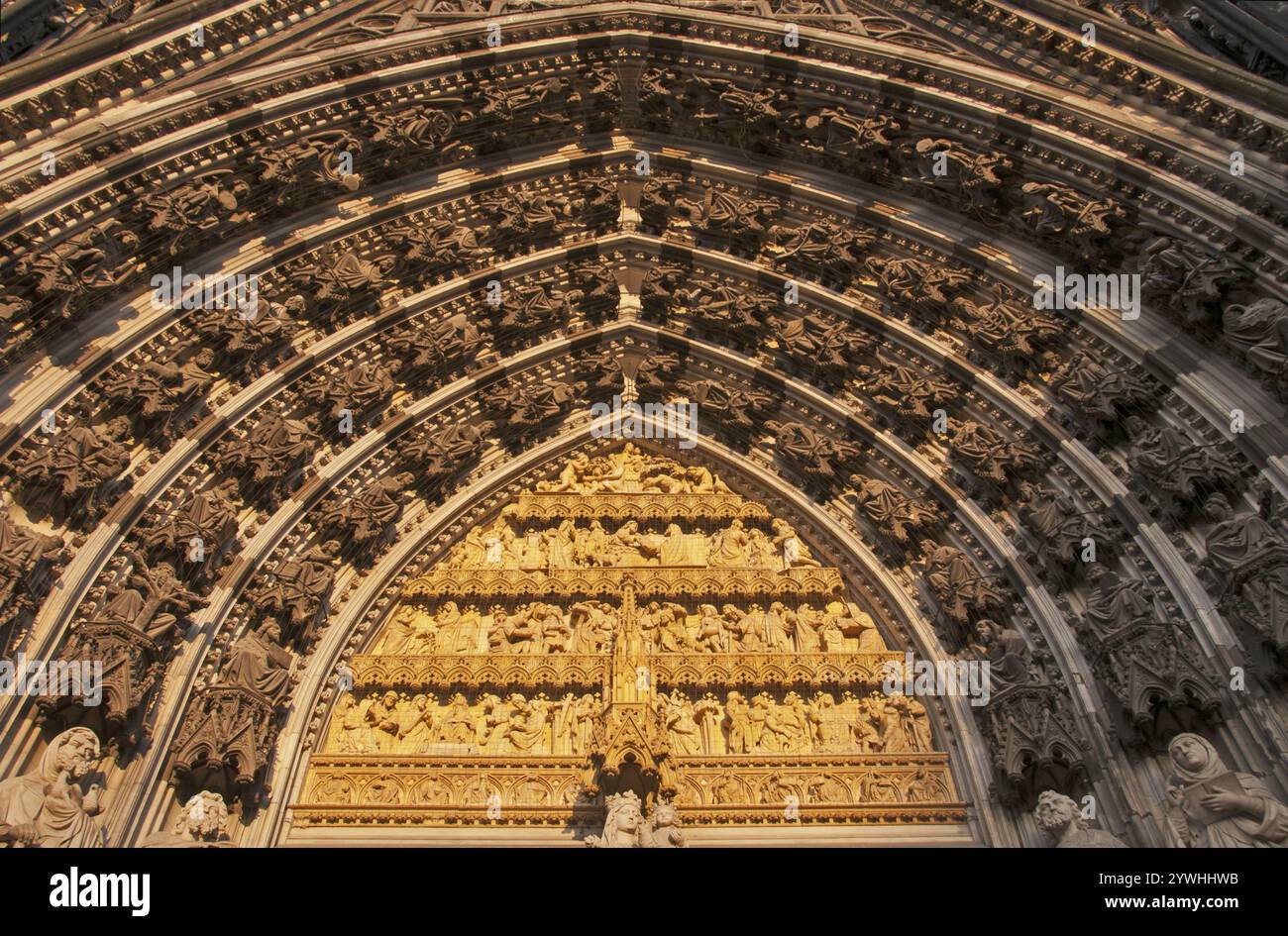 Main portal of the west facade of Cologne Cathedral with statue of the ...