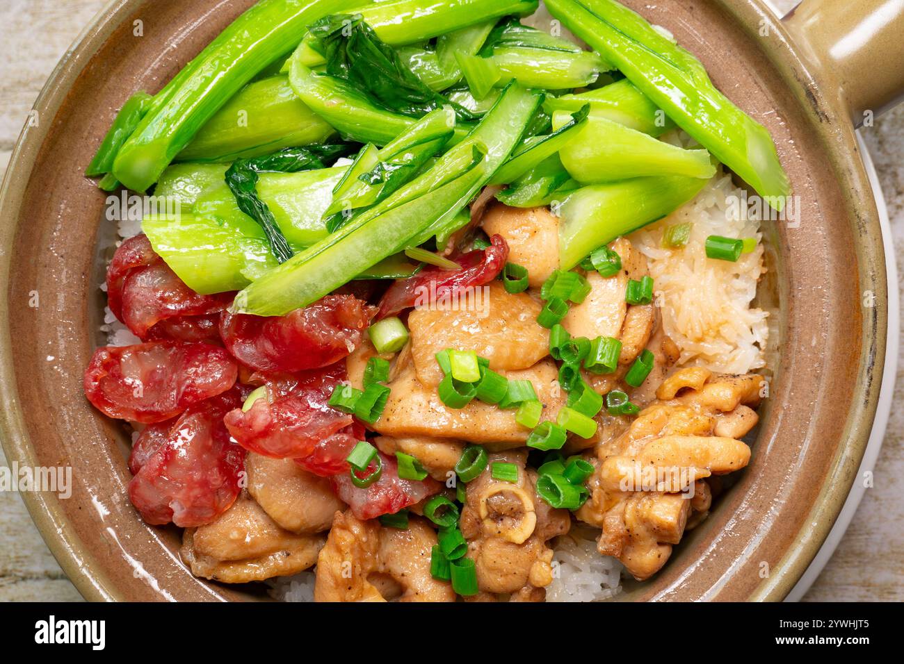 top view clay pot rice of chicken and Chinese style sausage and ...