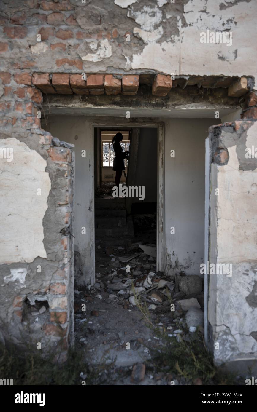 Entrance to an abandoned ruined residential building, old Soviet ...