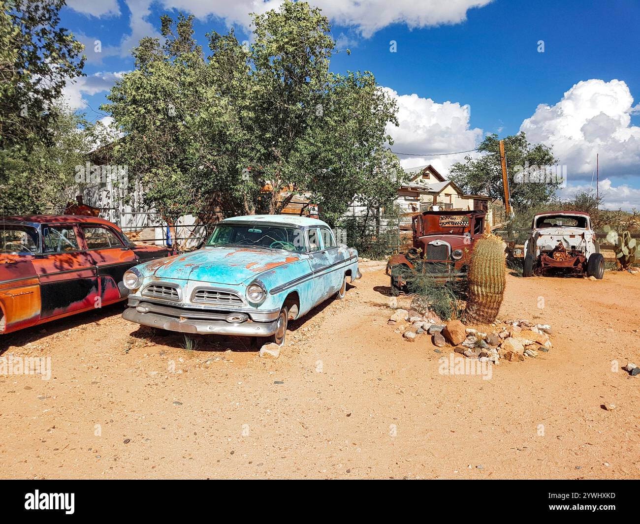 Vintage Rusty Cars in Desert Landscape with Blue Sky and Cactu Stock ...