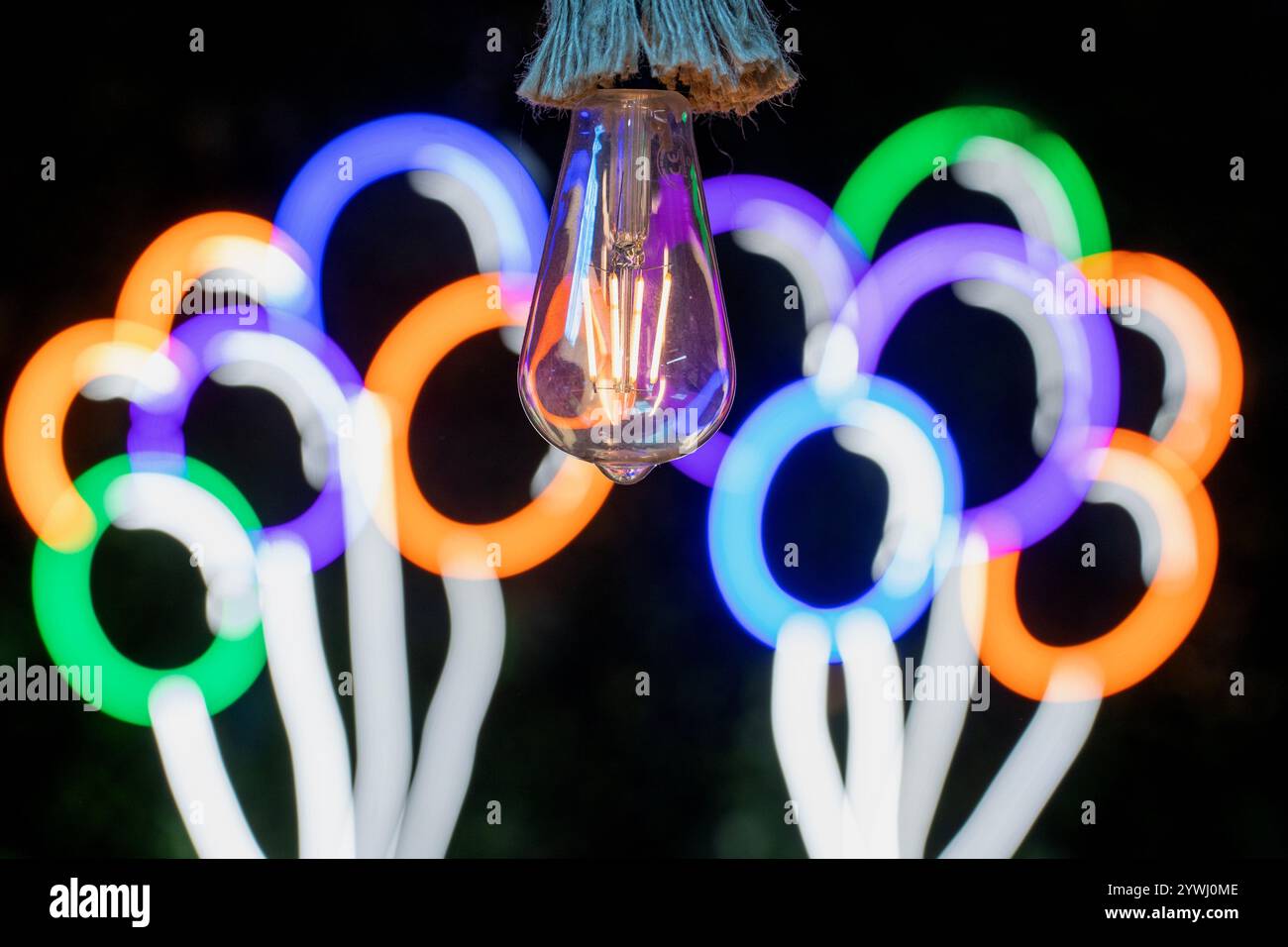 Radiant Glow: Light Bulb and Neon Balloon Festivities Stock Photo - Alamy