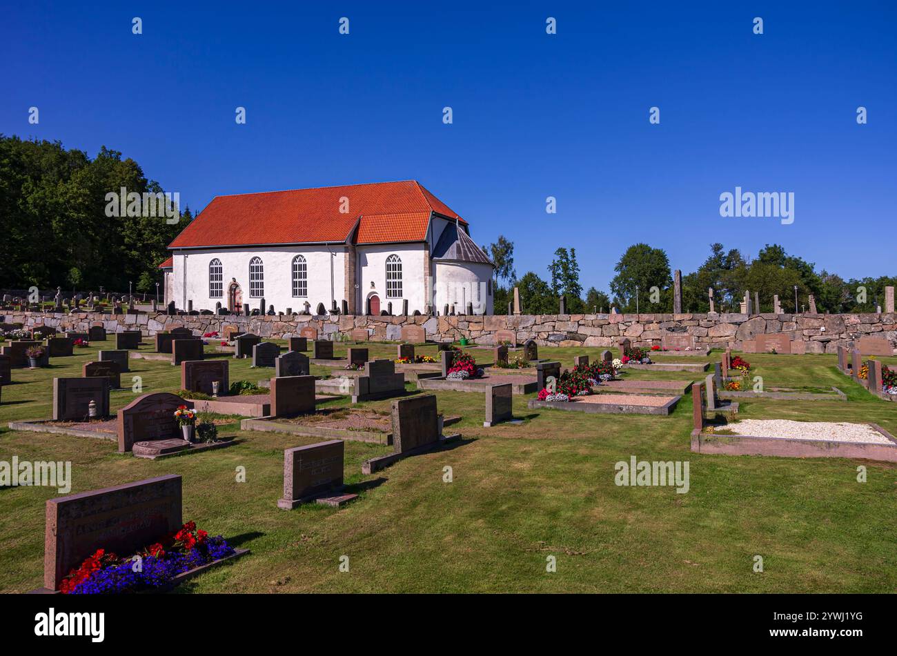 Picturesque view of Skee kyrka, a 12th century church and cemetery in ...