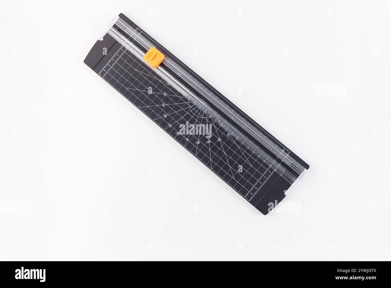 Paper trimmer to cut paper into strips on a white background. Studio ...