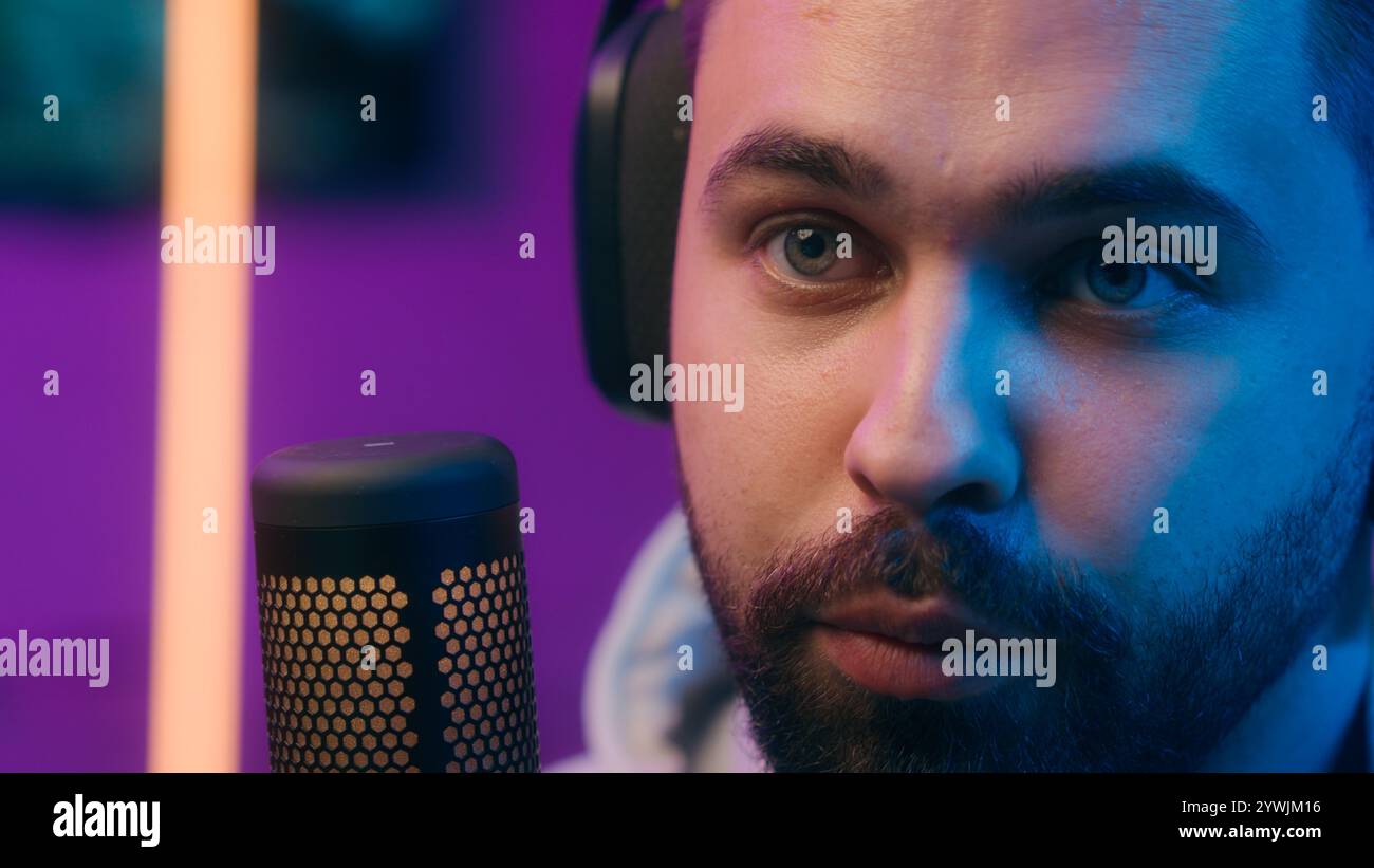 Carefree glad Caucasian gamer influencer male blogger host man putting ...