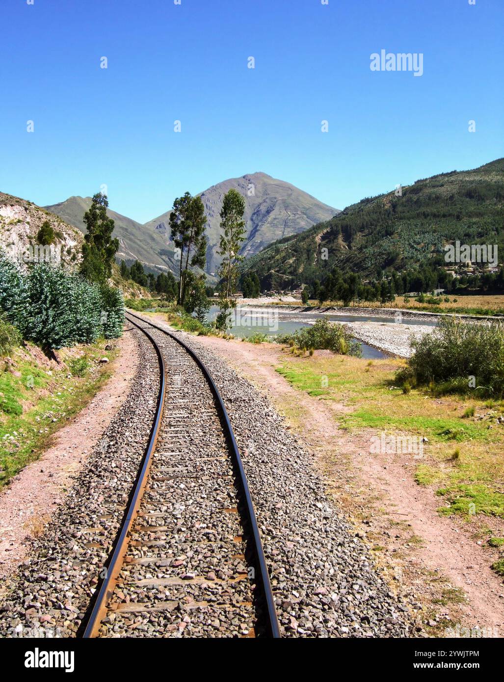 View along railway line next to river in the Altiplano Andean Plateau ...