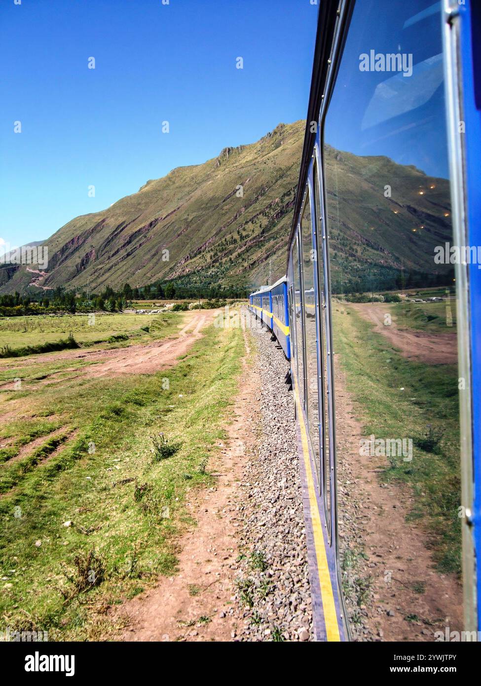 View along long railway line with Andean Explorer tourist train in the ...