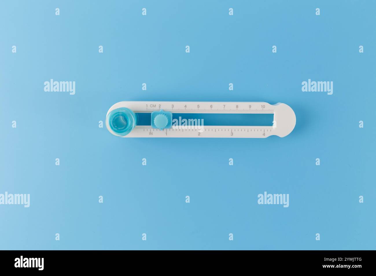 manual rotary circle cutter on blue background, top view, circle cutter ...