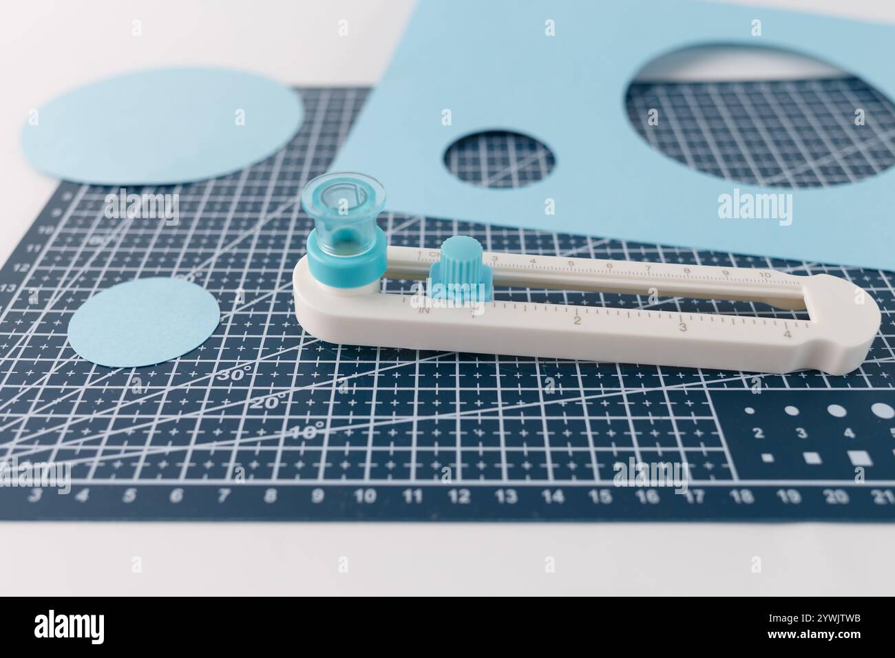 crafting tool and materials for cutting circles, including blue cutting ...