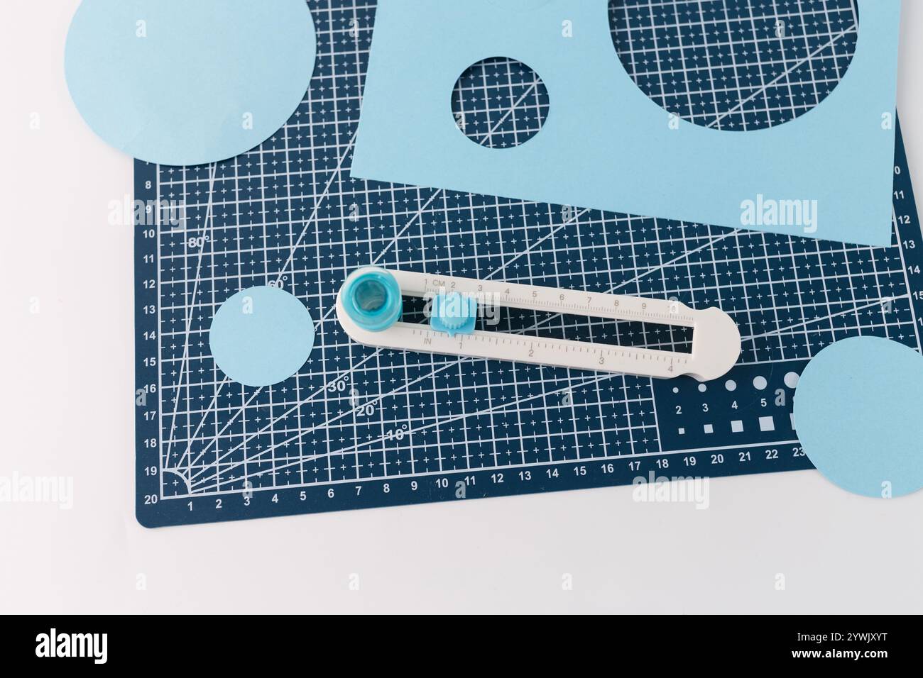 top down view of Paper circle cutter tool. Close-up. Manual rotary ...