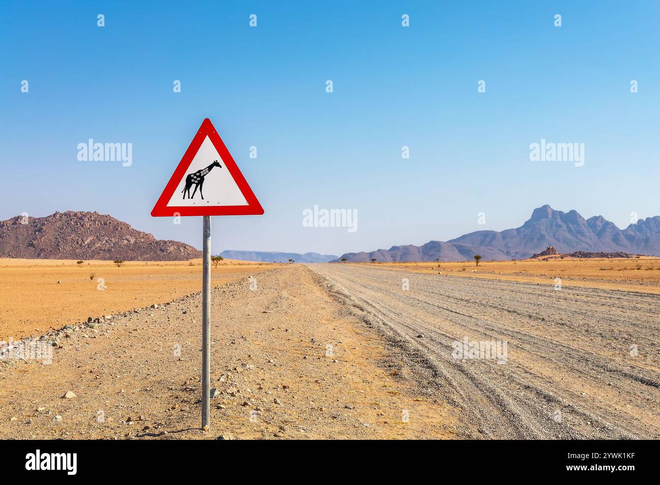Caution Giraffe, wildlife road sign in the NamibRand Nature Reserve in ...
