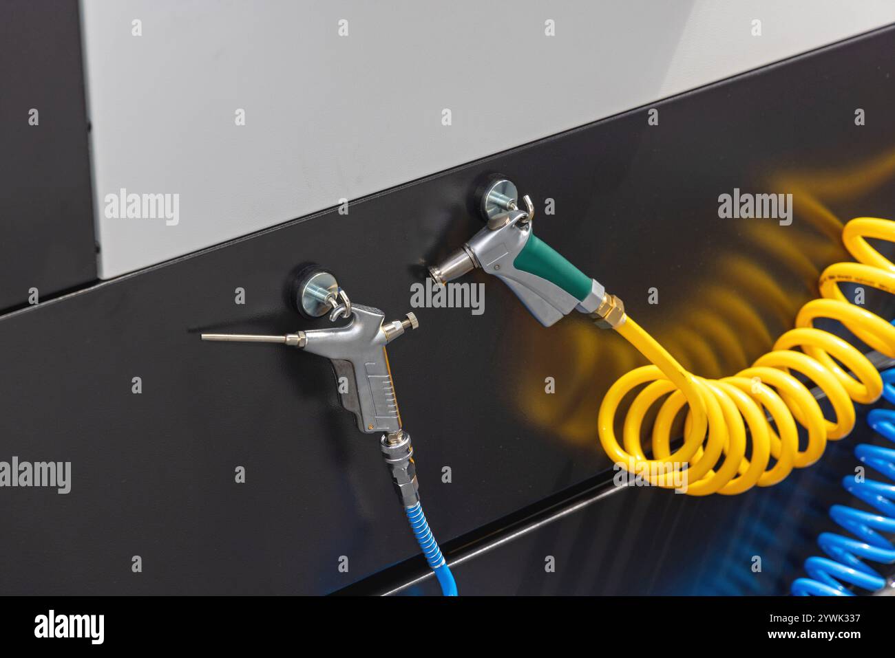 Two Compressed Air Blow Gun at Machine in Workshop Stock Photo - Alamy
