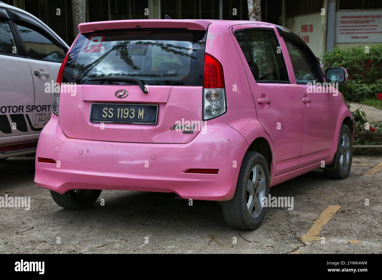 SABAH, MALAYSIA - MARCH 4, 2024: Pink small car Perodua Myvi parked in ...
