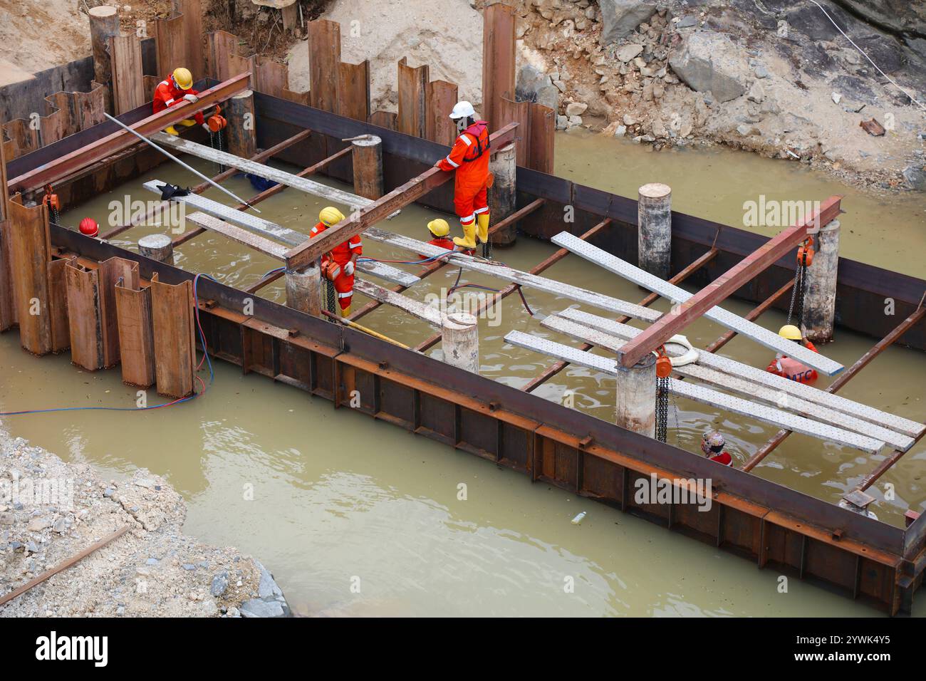 SINGAPORE CITY, SINGAPORE - MARCH 11, 2024: Construction workers on ...