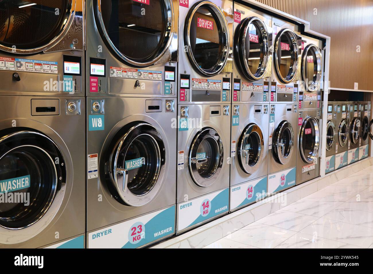 SINGAPORE CITY, SINGAPORE - MARCH 11, 2024: Self-service laundry in ...