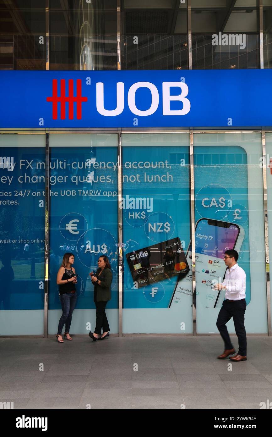 SINGAPORE CITY, SINGAPORE - MARCH 13, 2024: People visit UOB Bank branch in Singapore. United ...