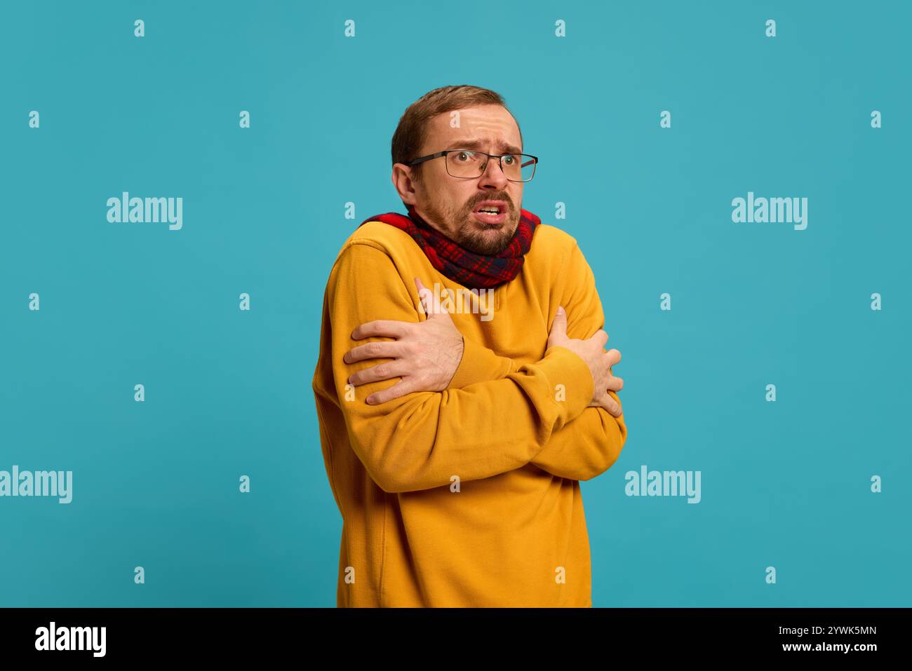 Portrait of cold, sick man dressed casual attire posing as he feeling ...