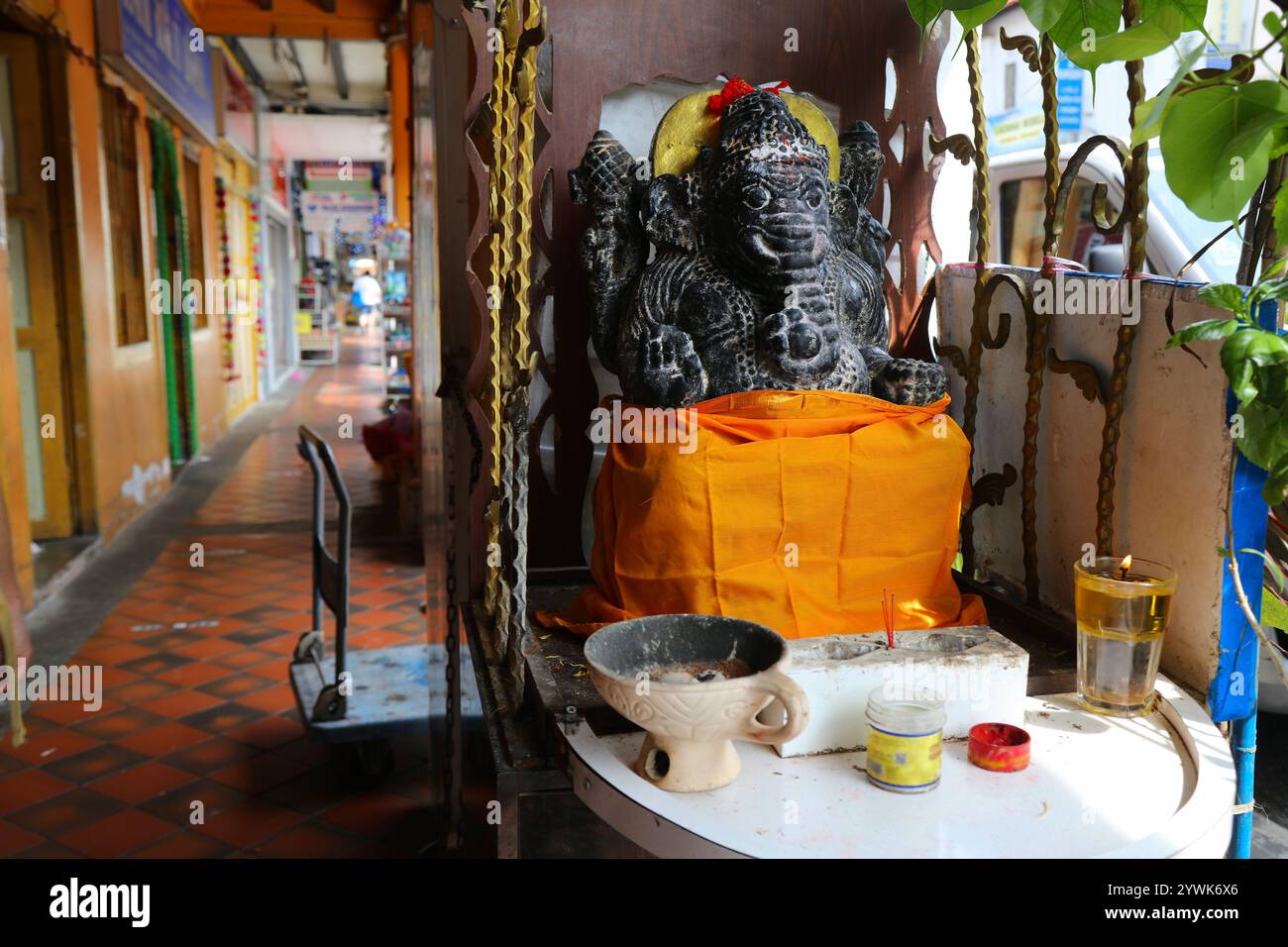 Singapore Little India street view. Small street shrine for Hindu deity ...