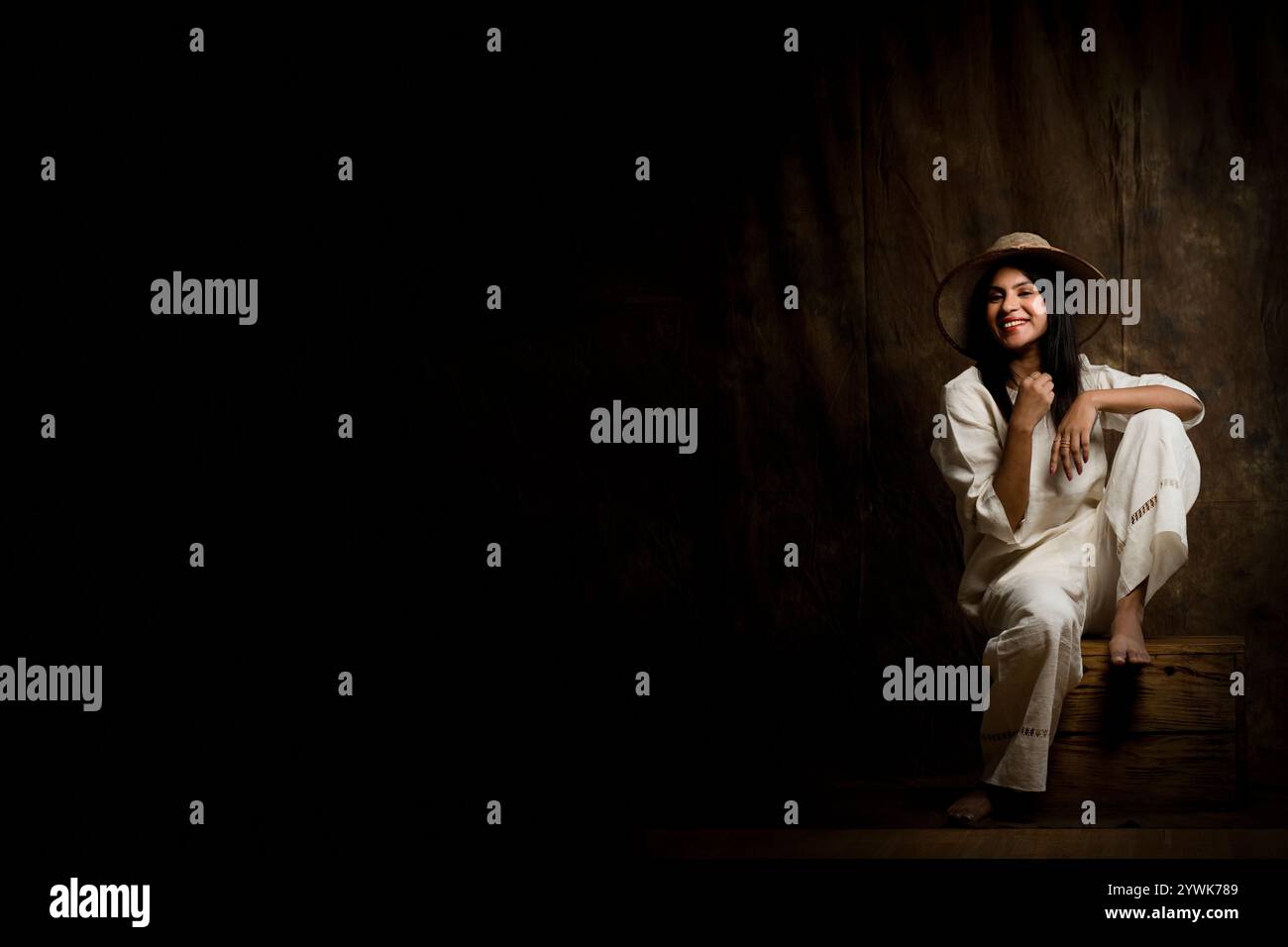 A stunning female model showcasing elegance in a pristine white linen ...