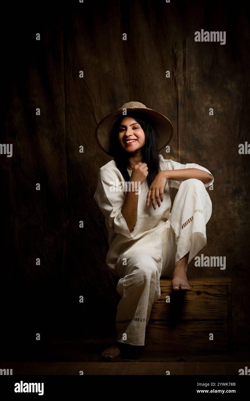 A stunning female model showcasing elegance in a pristine white linen ...