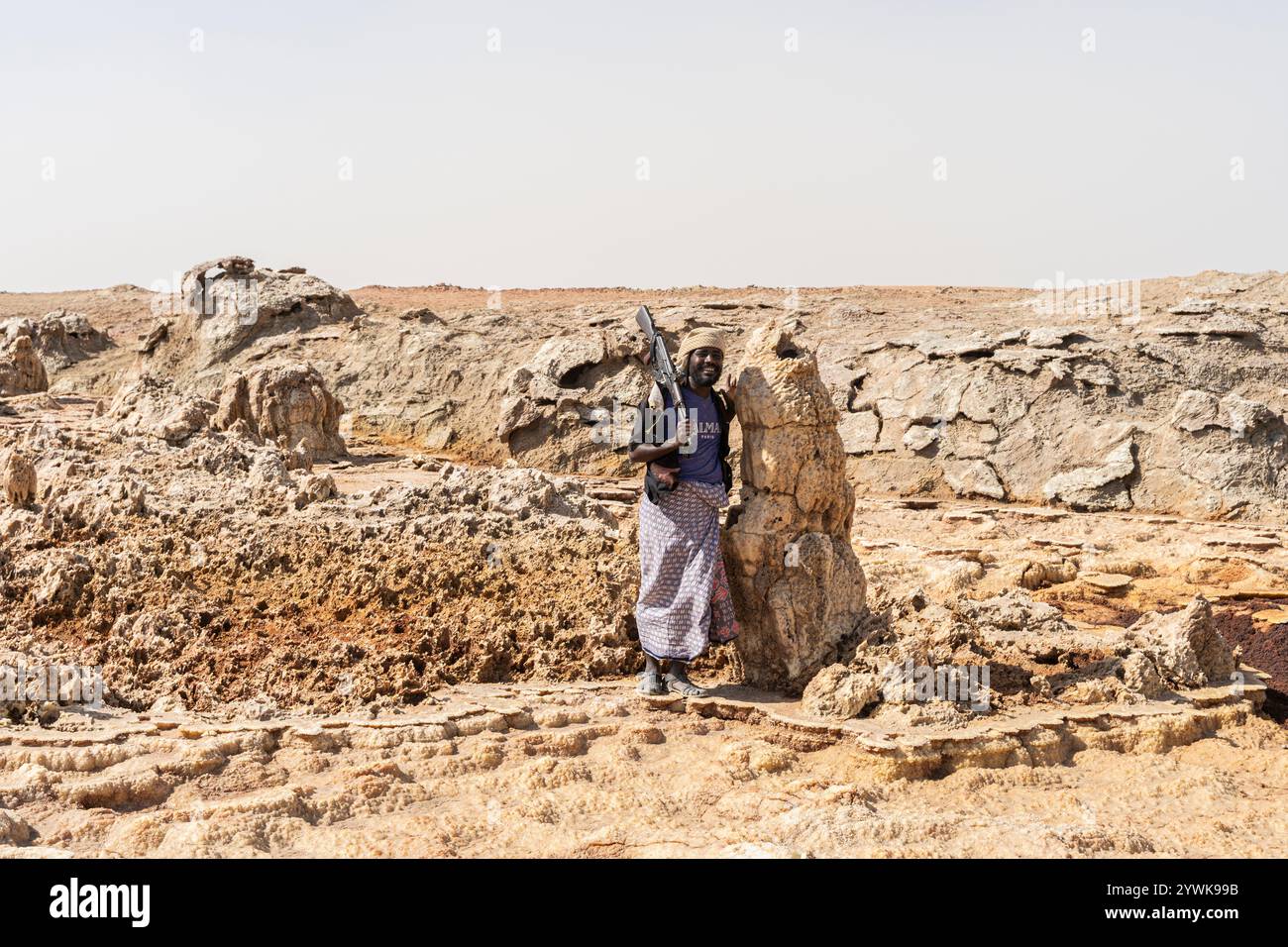 Security guard with volcanic landscape of Dallol in Background ...
