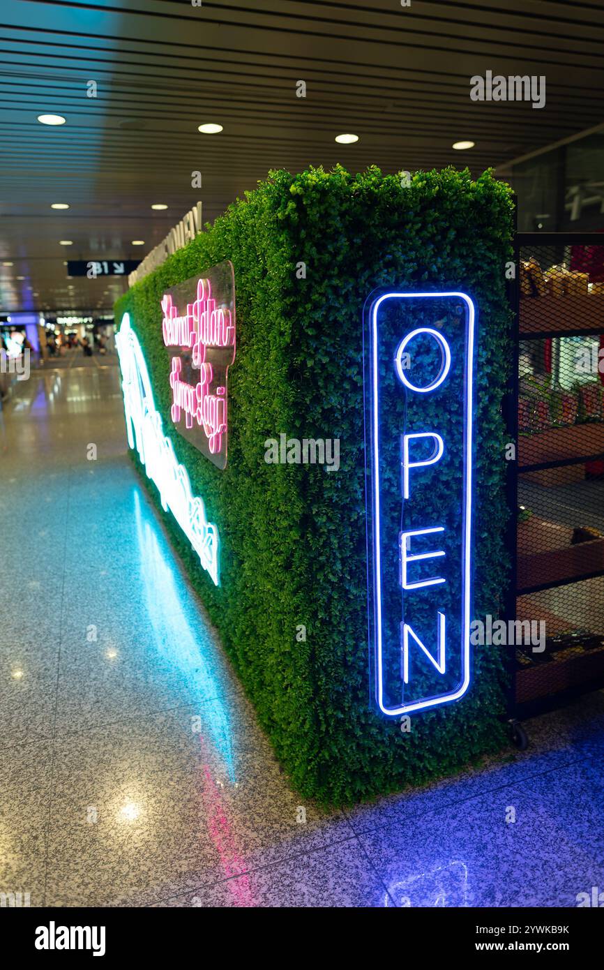 KUALA LUMPUR, MALAYSIA - NOVEMBER 27, 2023: neon "OPEN" sign at KLIA ...