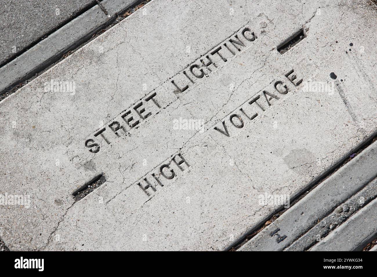 Street lighting manhole cover in Los Angeles. High voltage electricity ...