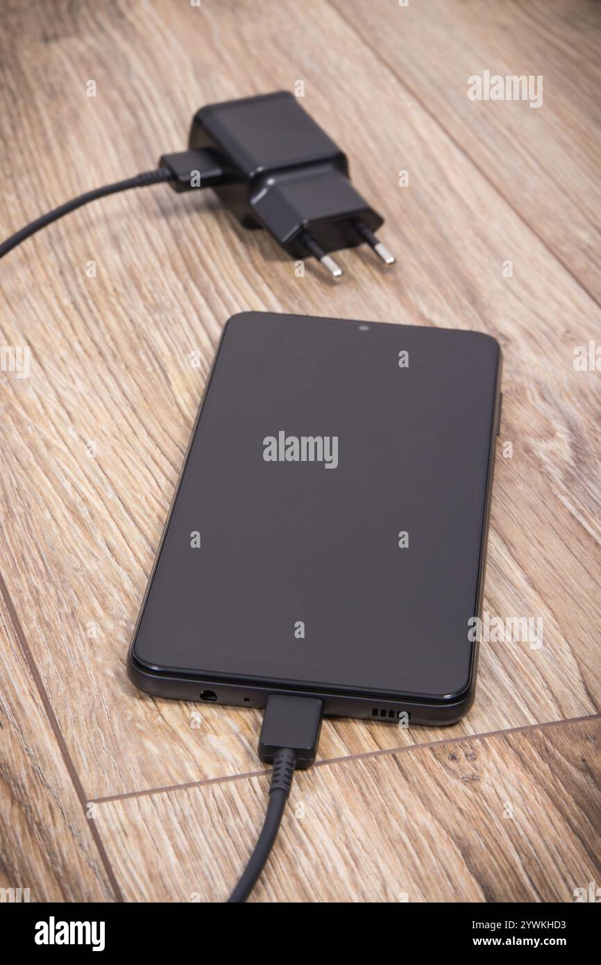 Smartphone, mobile phone and charger using to charge empty battery ...
