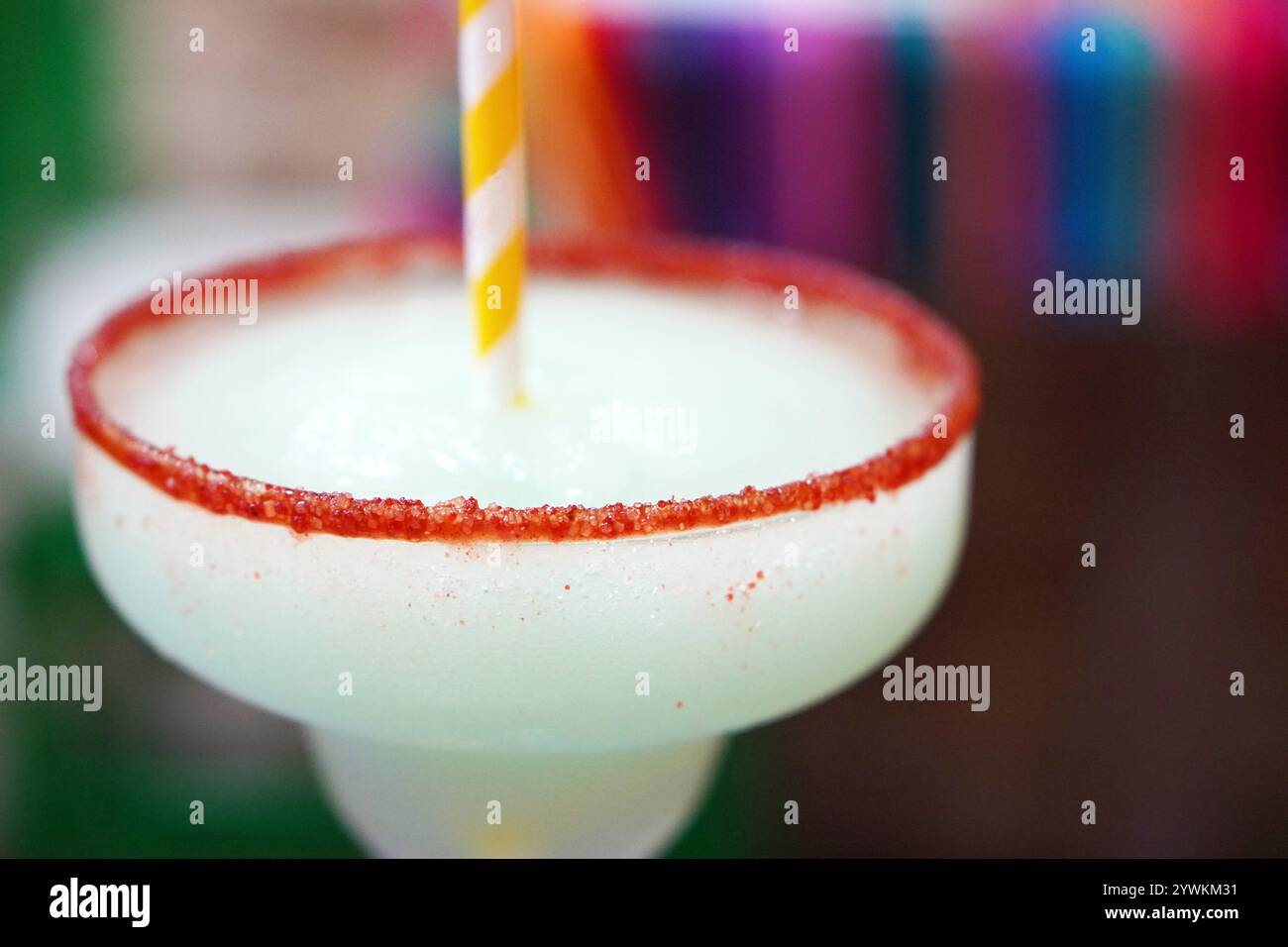 mexican gastronomy. close up of margarita drink glass with red fruit ...