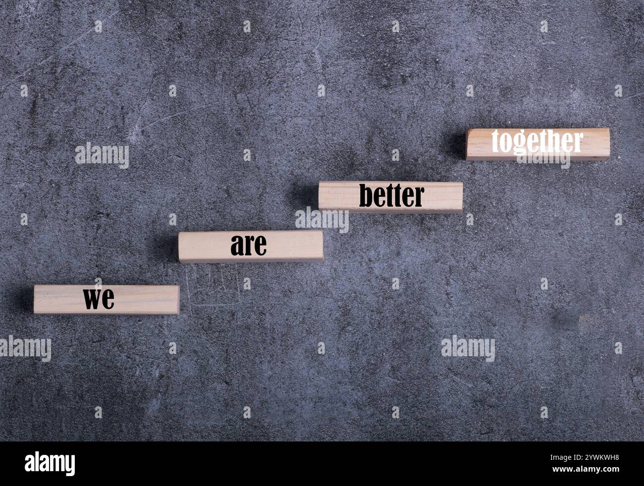 We are better together symbol. Wooden blocks with words We are better together. Beautiful grey ...