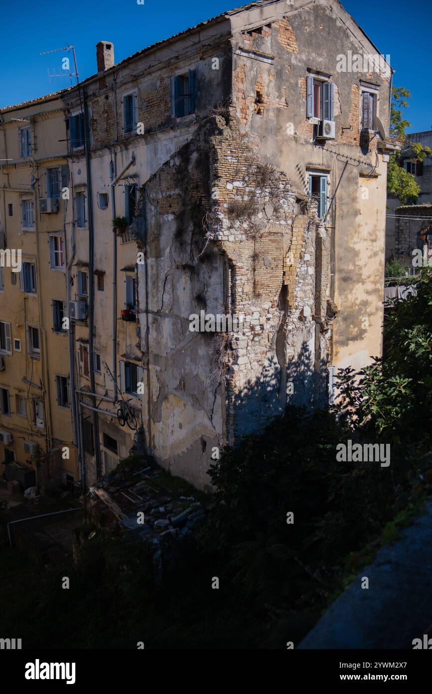 An old multi-story residential building in terrible condition. Chaotic ...