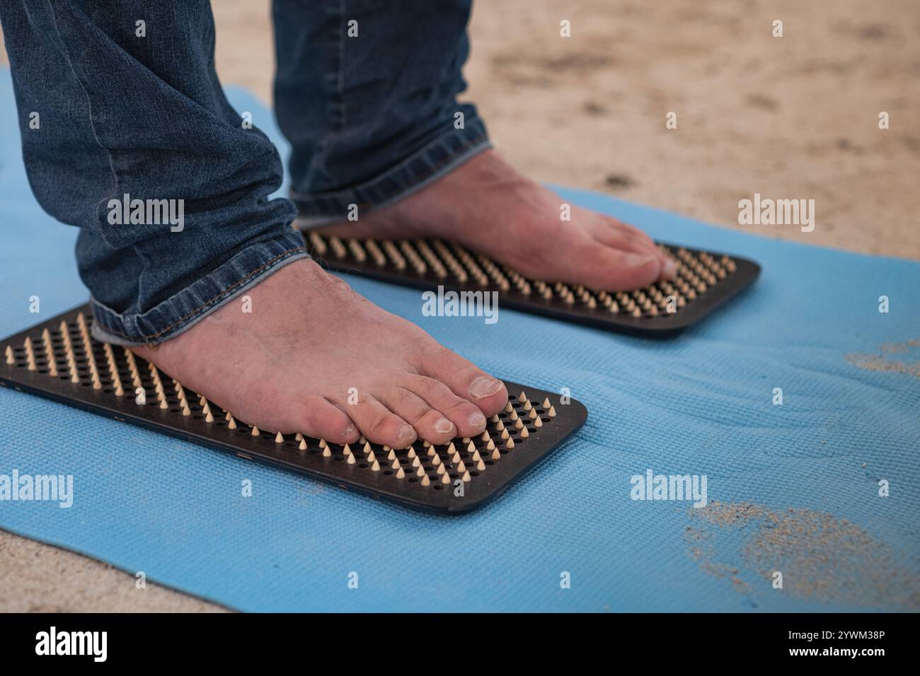 Male Feet Standing on Sadhu Boards. Close-up. Natural image of a man's ...