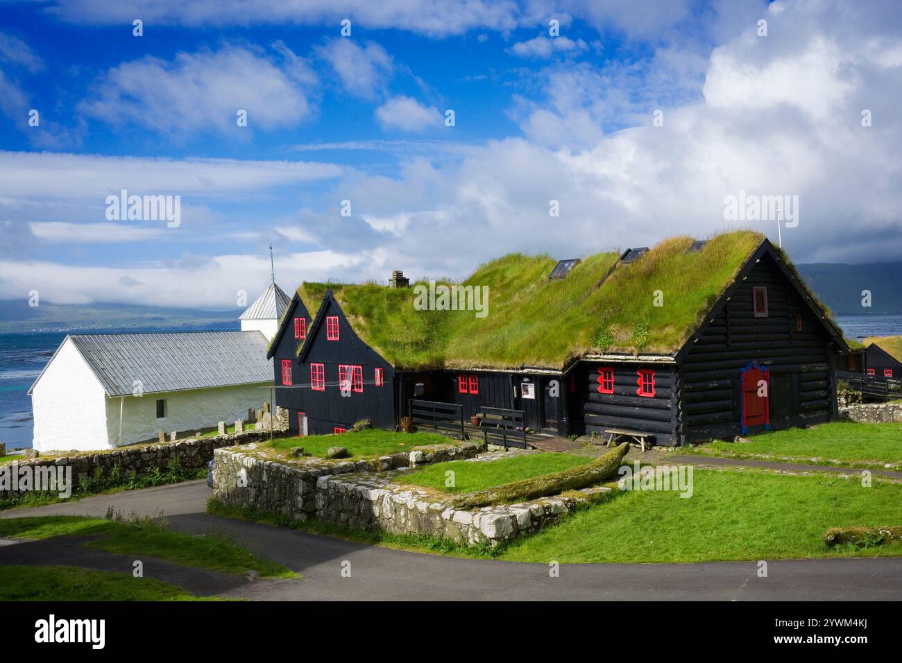 Log-built Bishop's Palace and Saint Olav's Church in Kirkjubøur, Faroe ...