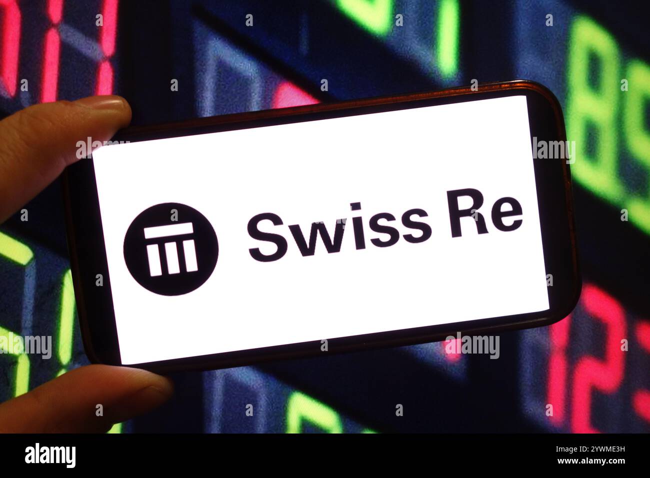 In this photo illustration, the Swiss Re company logo is seen displayed ...