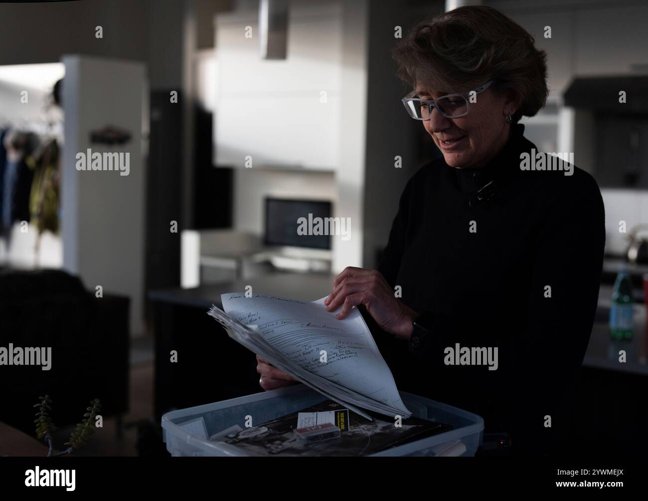 Two-time Olympian Joan Wilder looks through records from her time on ...